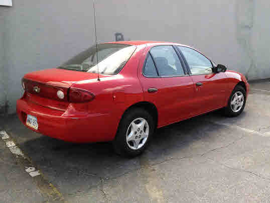 Red, grey cloth interior, 4 cylinder (EcoTec), 5 speed, 4 door, a/c, am ...