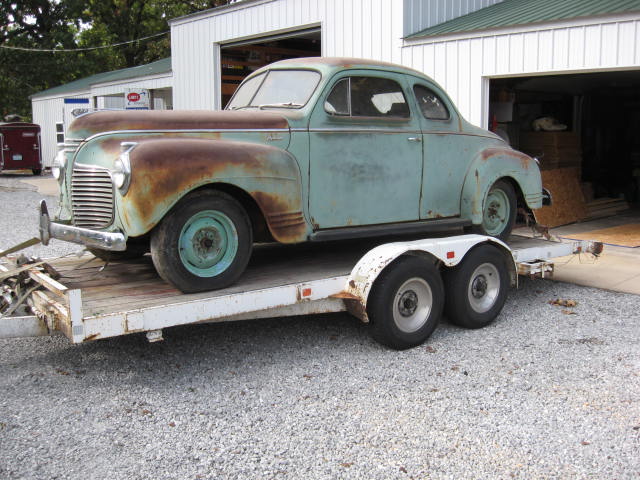 Light green, tan cloth interior, in-line 6 cyl, 3 speed, head is off ...