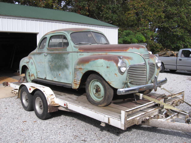 Light green, tan cloth interior, in-line 6 cyl, 3 speed, head is off ...
