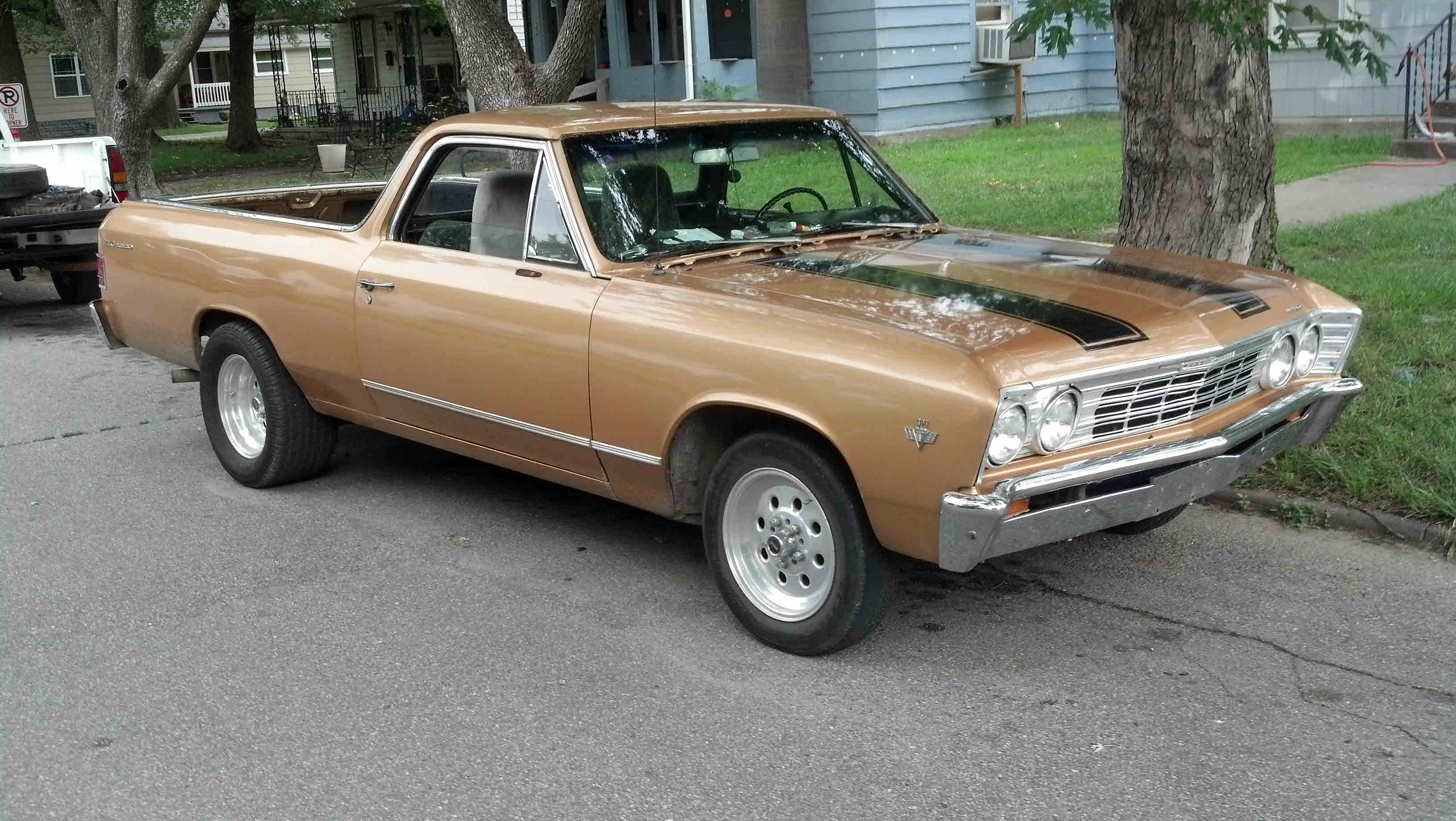 Gold w/black stripes, needs nicer seats, has nice headliner, newer ...