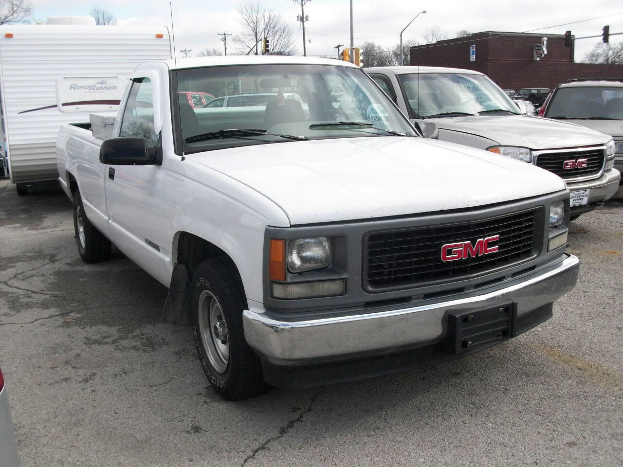 White, V-6, 5 speed, 2 door, am radio, 240,000 miles, local trade-in